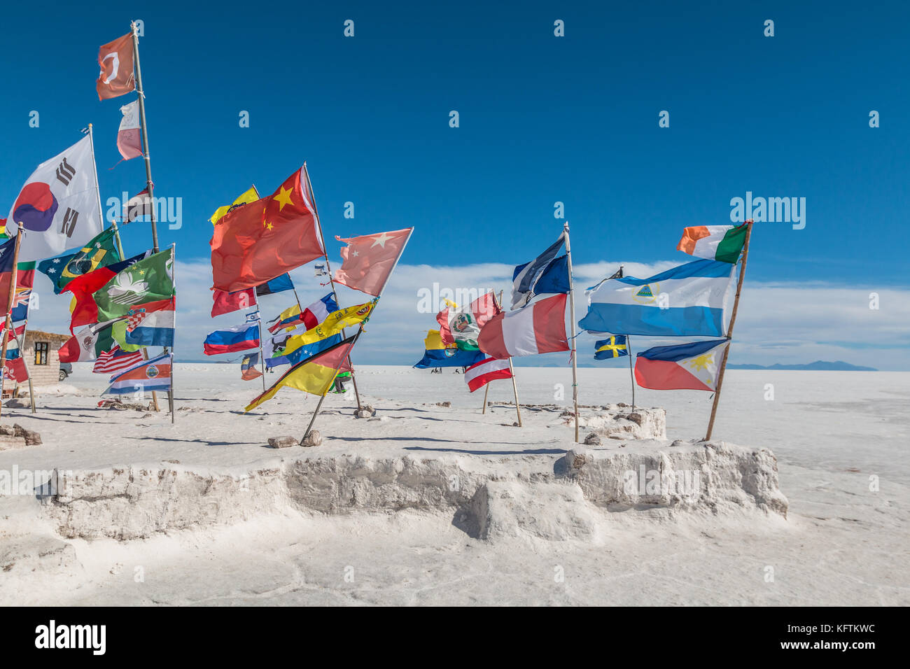 Flags in Salar Uyuni Salt Flats in Bolivia Stock Photo - Alamy