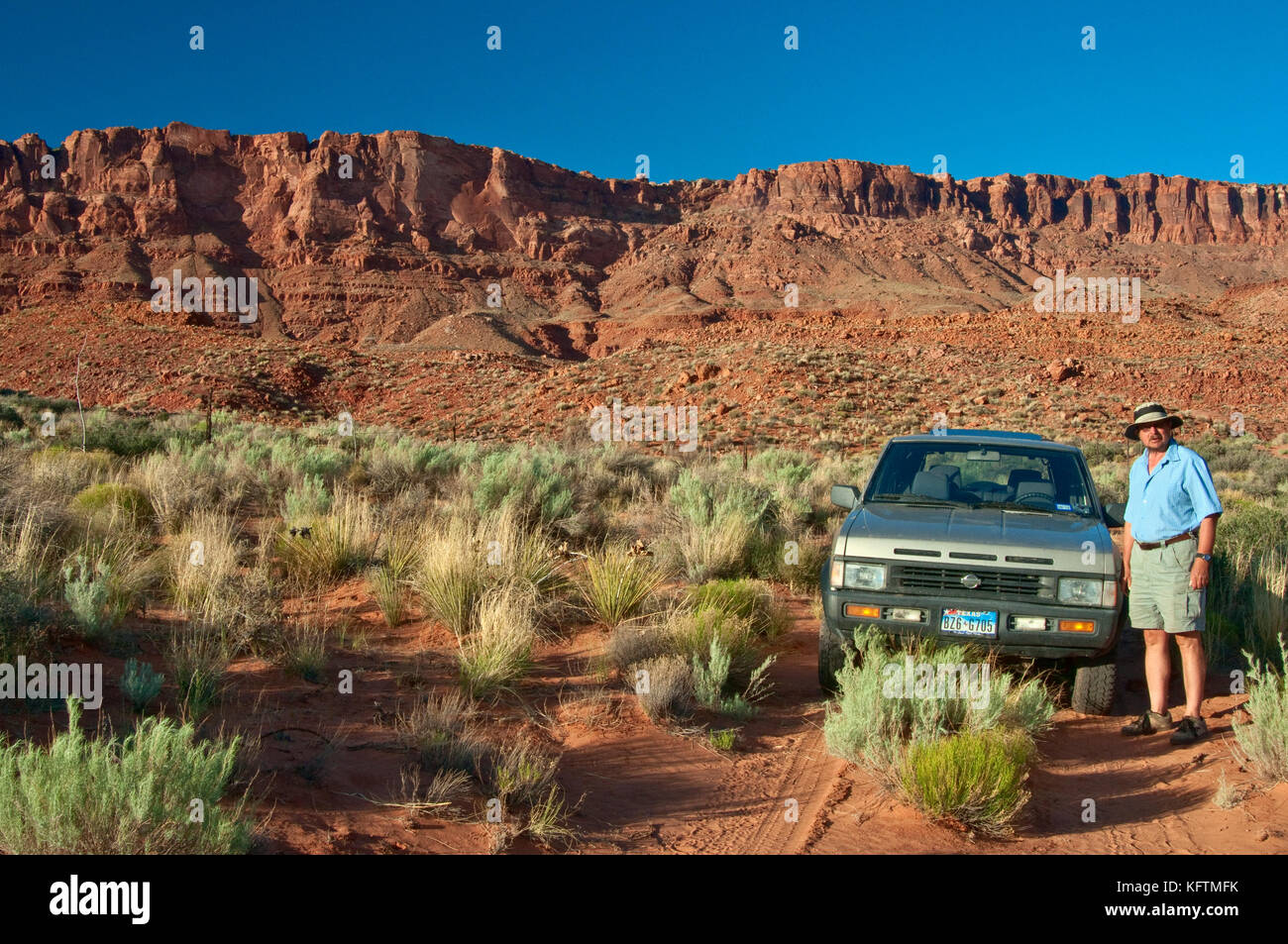 Middle age man, vehicle on dirt track in Jacobs Pool water well area ...