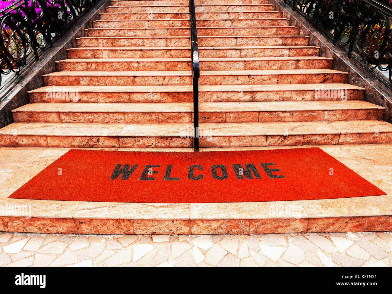 welcome plastic red carpet in front of the marble staircase at the ...