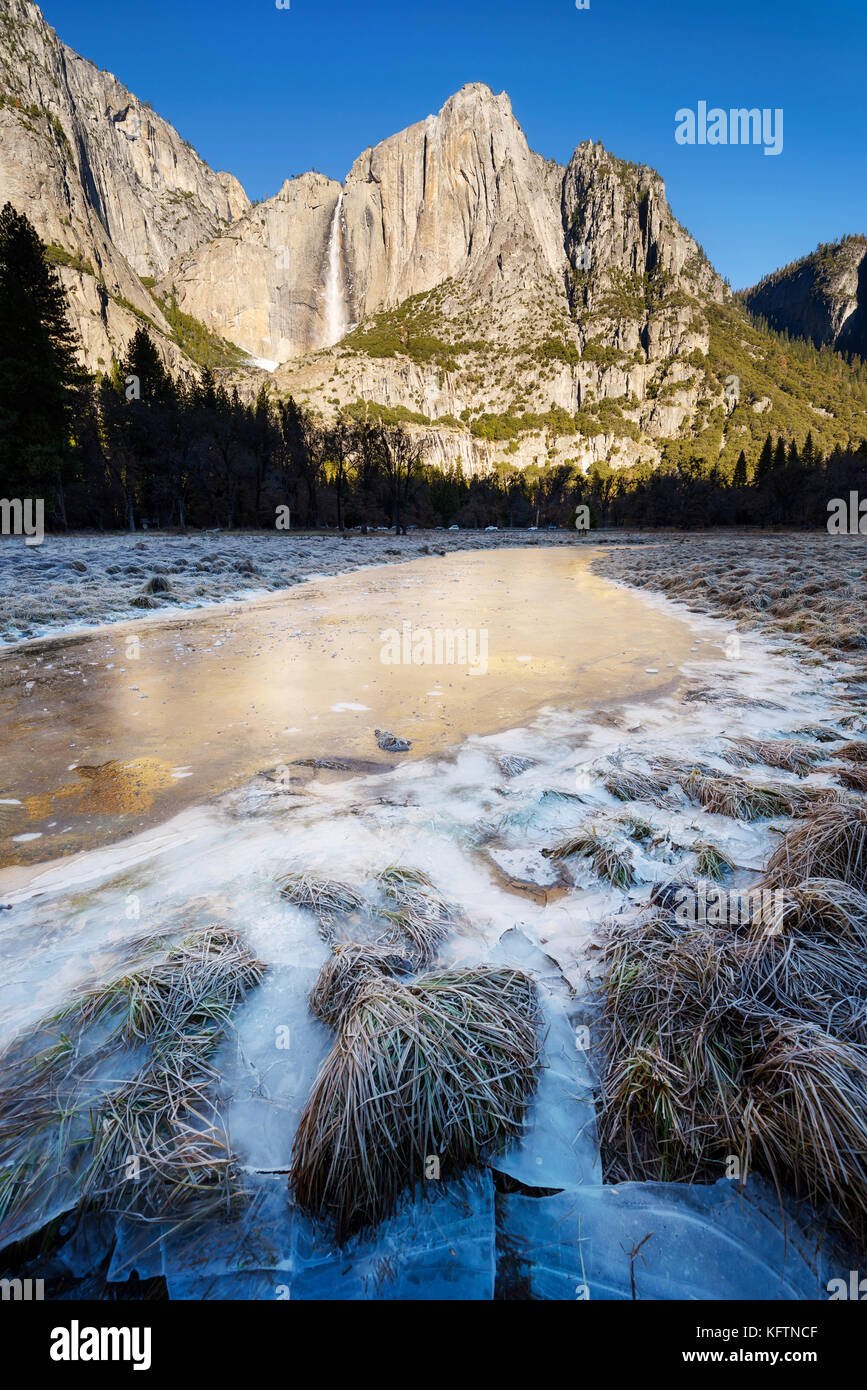 Yosemite Fall during winter at Cook's meadow. Reflection of sun light ...