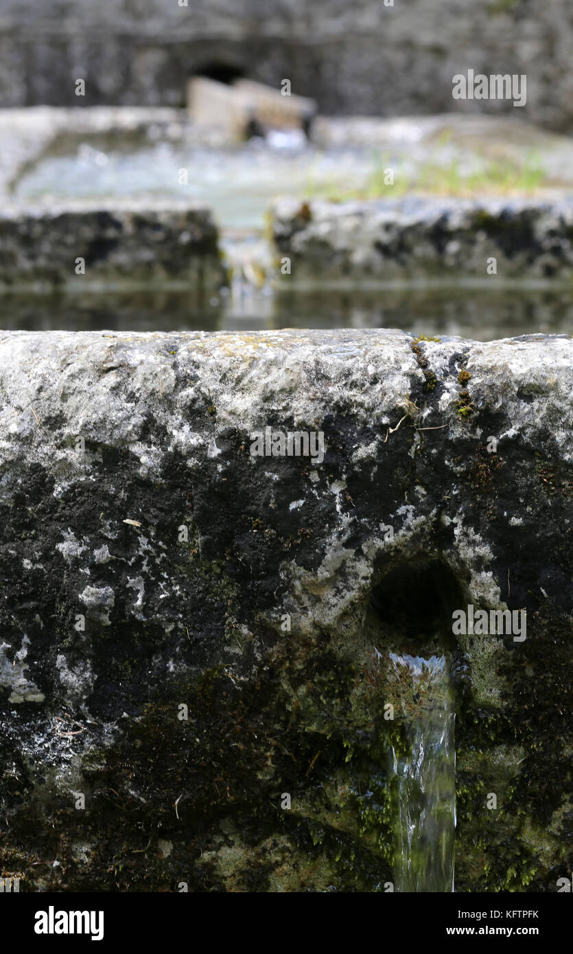 detail of a fountain made of stone and drinking water flowing Stock ...