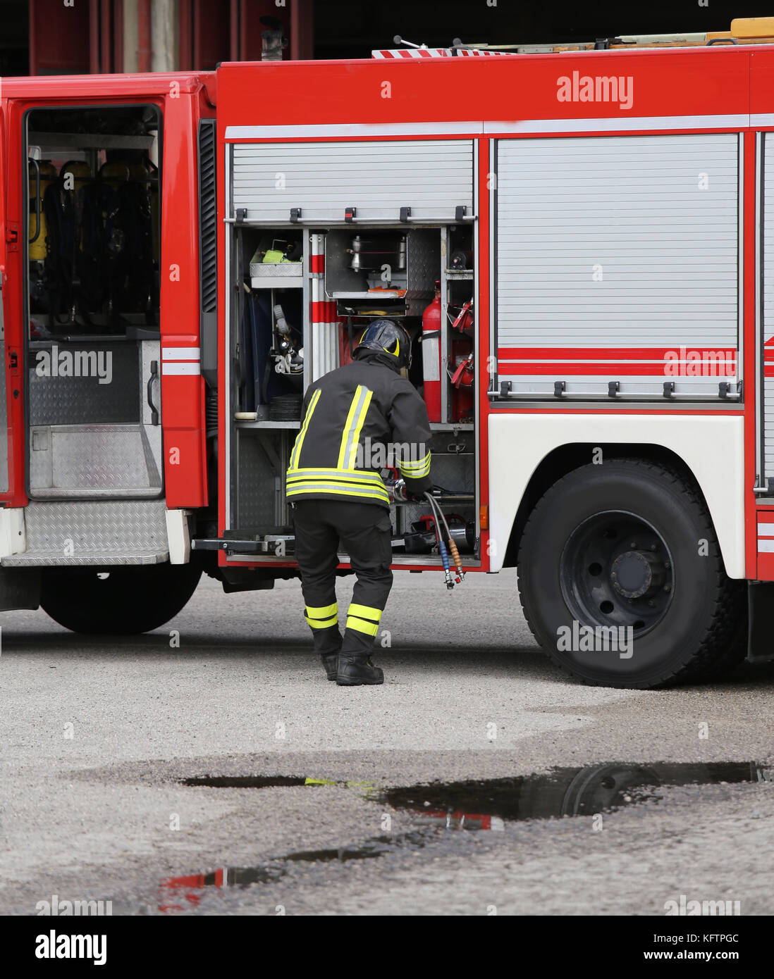 brave firefighters and their fire truck during a rescue mission Stock ...