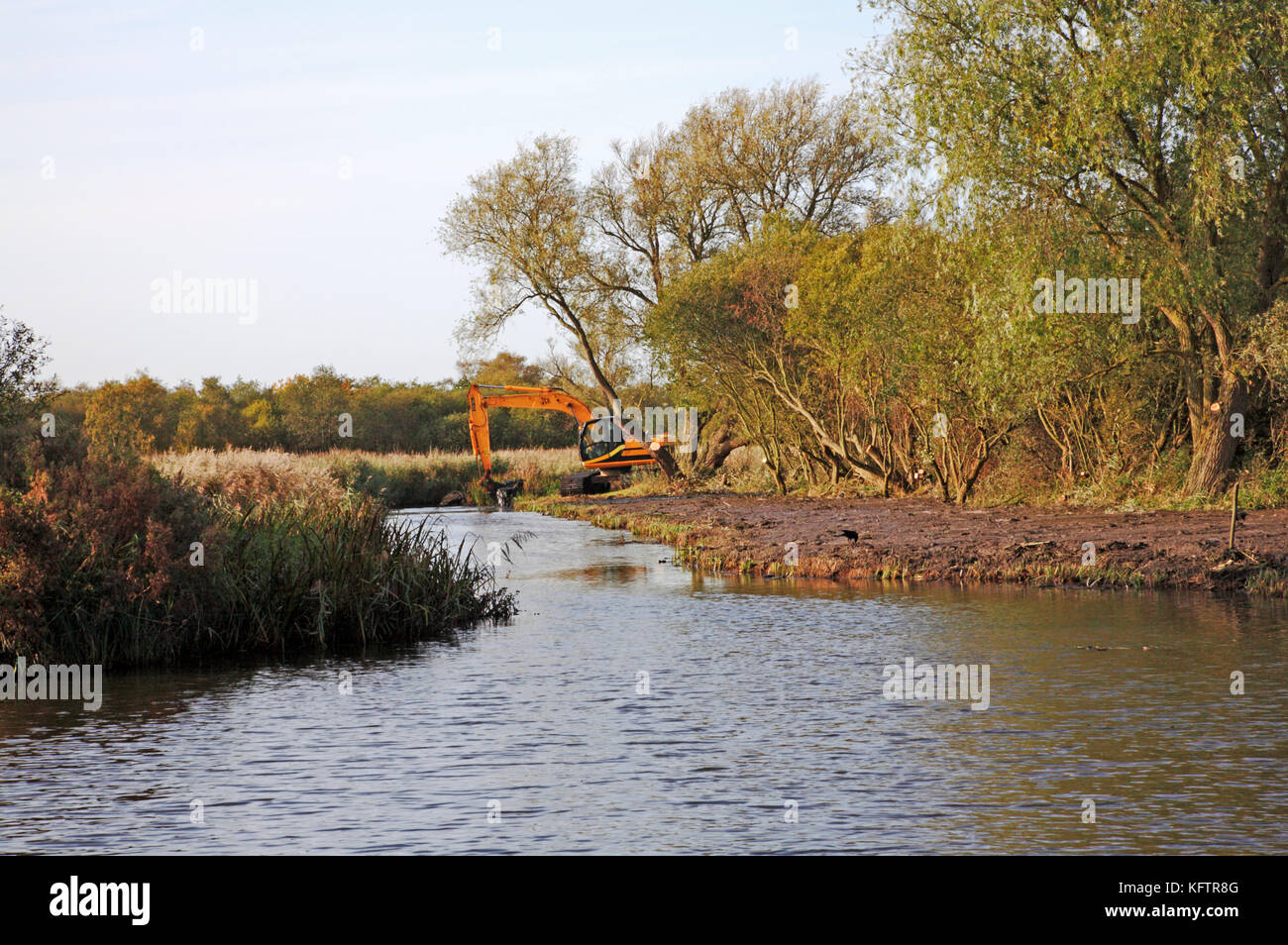 A JCB working on dyke and bank maintenance by the River Ant on the ...