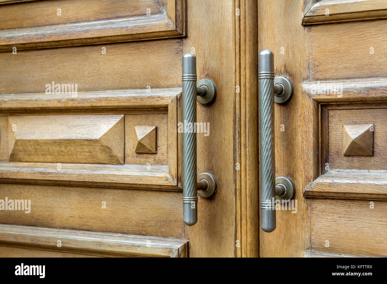 Decorative metal handles of old wooden door Stock Photo - Alamy