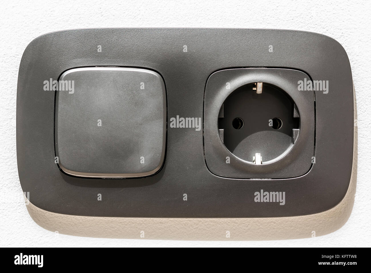Close-up of black electric socket with light switch Stock Photo - Alamy