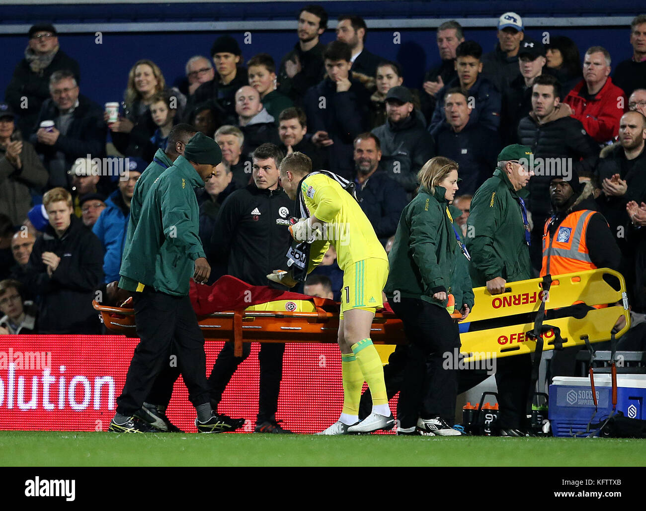 Sheffield United goalkeeper Simon Moore checks on Jamal Blackman who ...