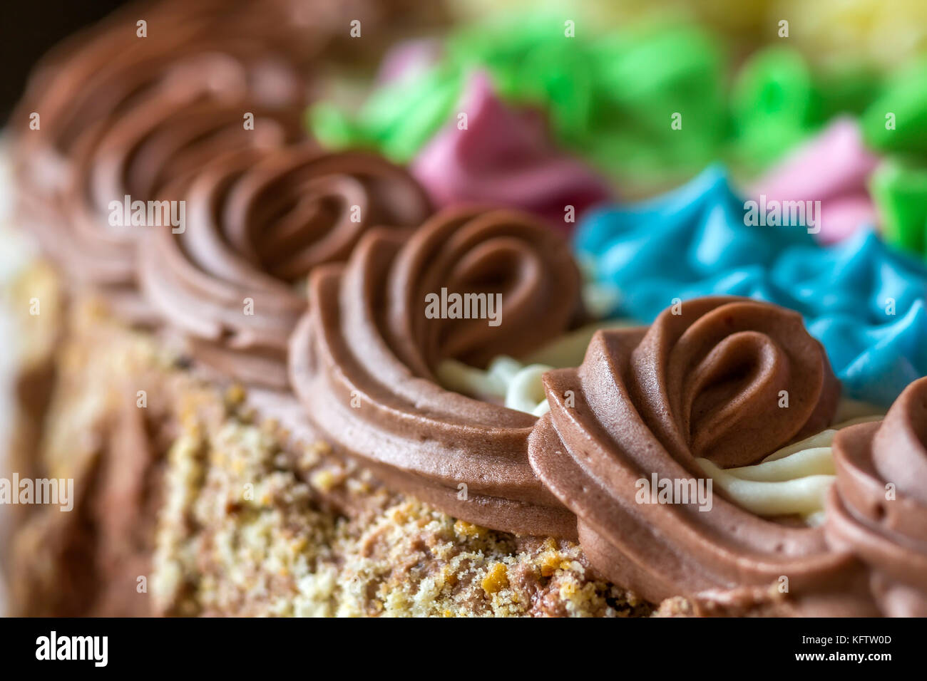Close-up of sweet colorful cream on top of a cake Stock Photo - Alamy