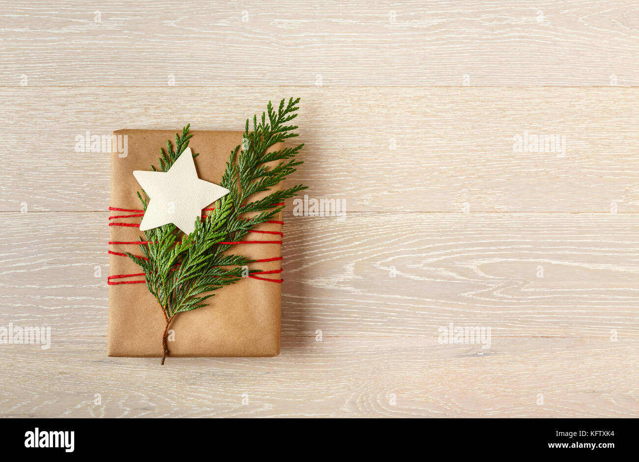 Christmas gift present wrapped in recycled wrapping paper with natural ...