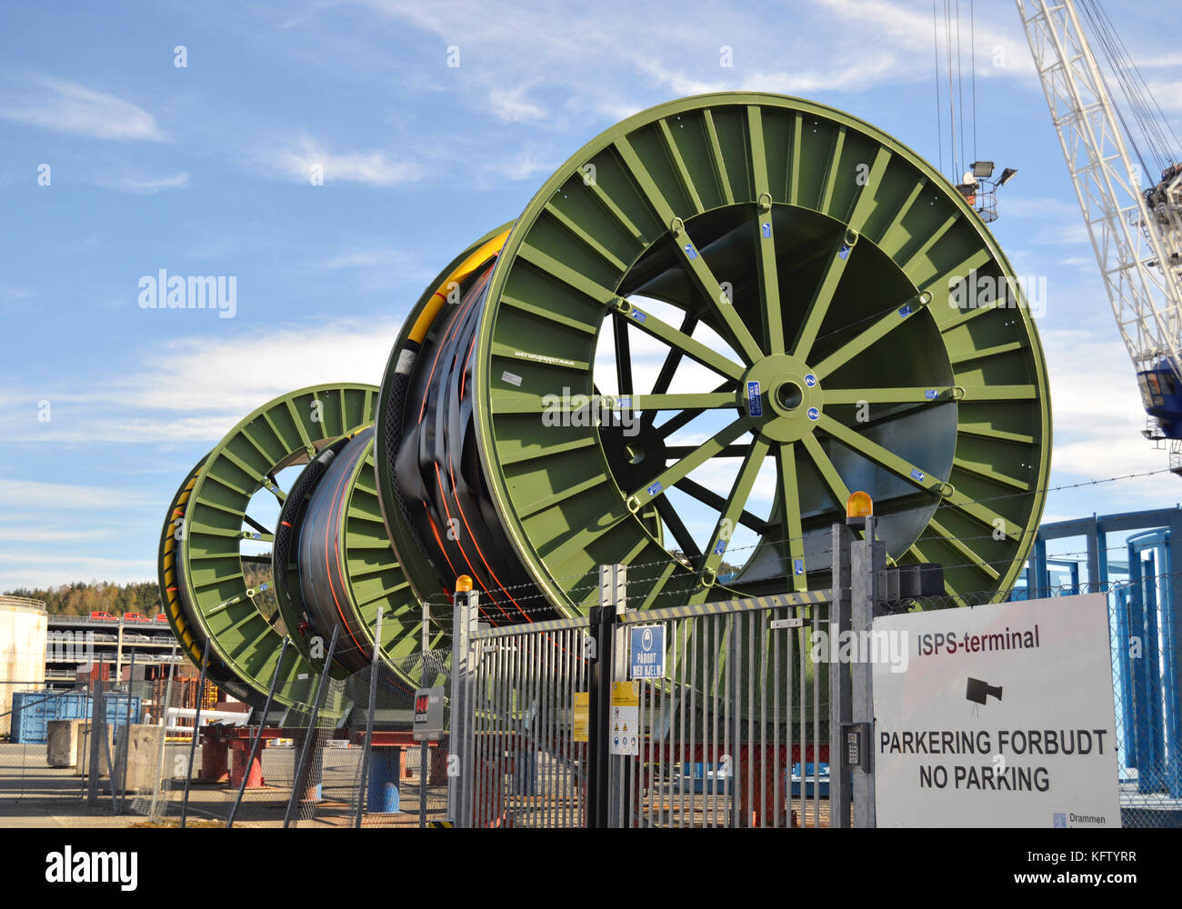 Three big industrial reels with cable-like material. From the port in ...