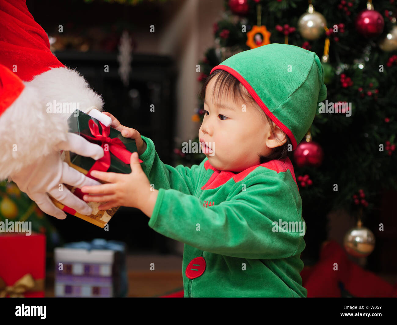 baby girl gets her christmas gift Stock Photo - Alamy