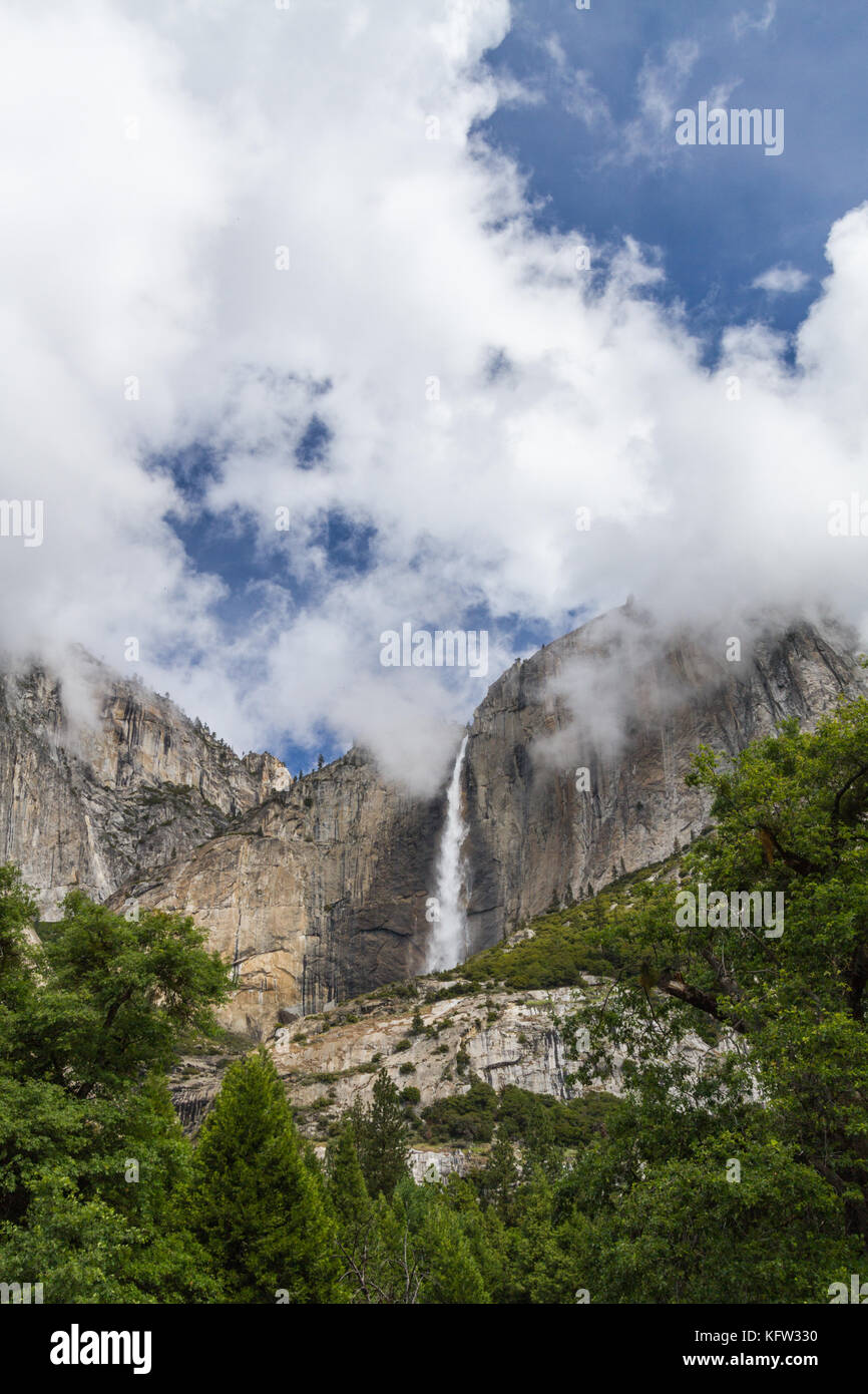 Vertical view of Upper Yosemite Fall with blue sky and clouds, Yosemite ...