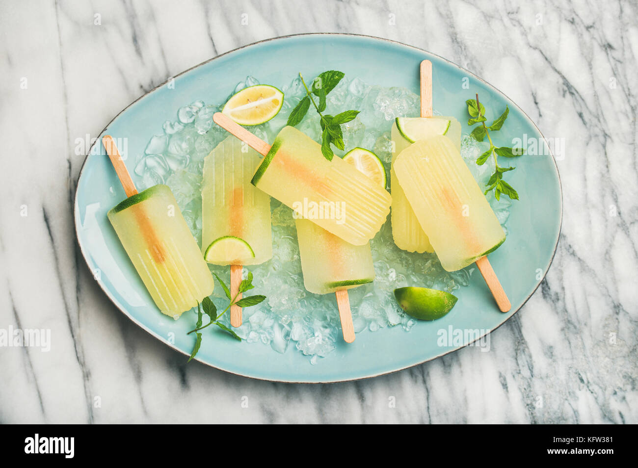 Summer lemonade popsicles with lime, mint leaves and chipped ice Stock ...