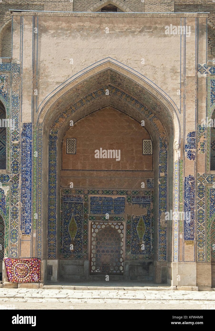 Arch and door with peeling traditional ancient Asian mosaic. the ...