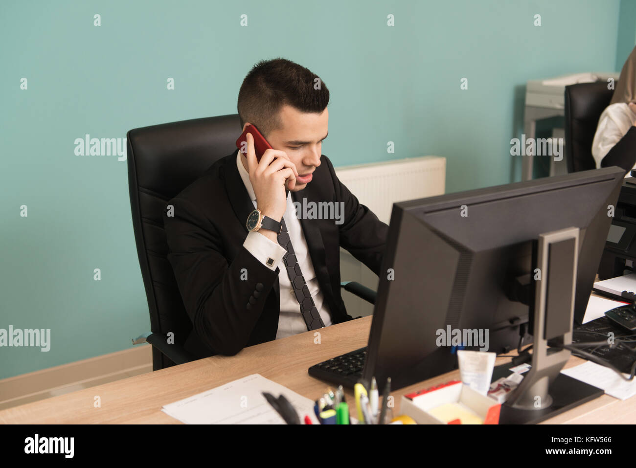 Young Handsome Businessman Working With Computer At Desk In The Modern ...