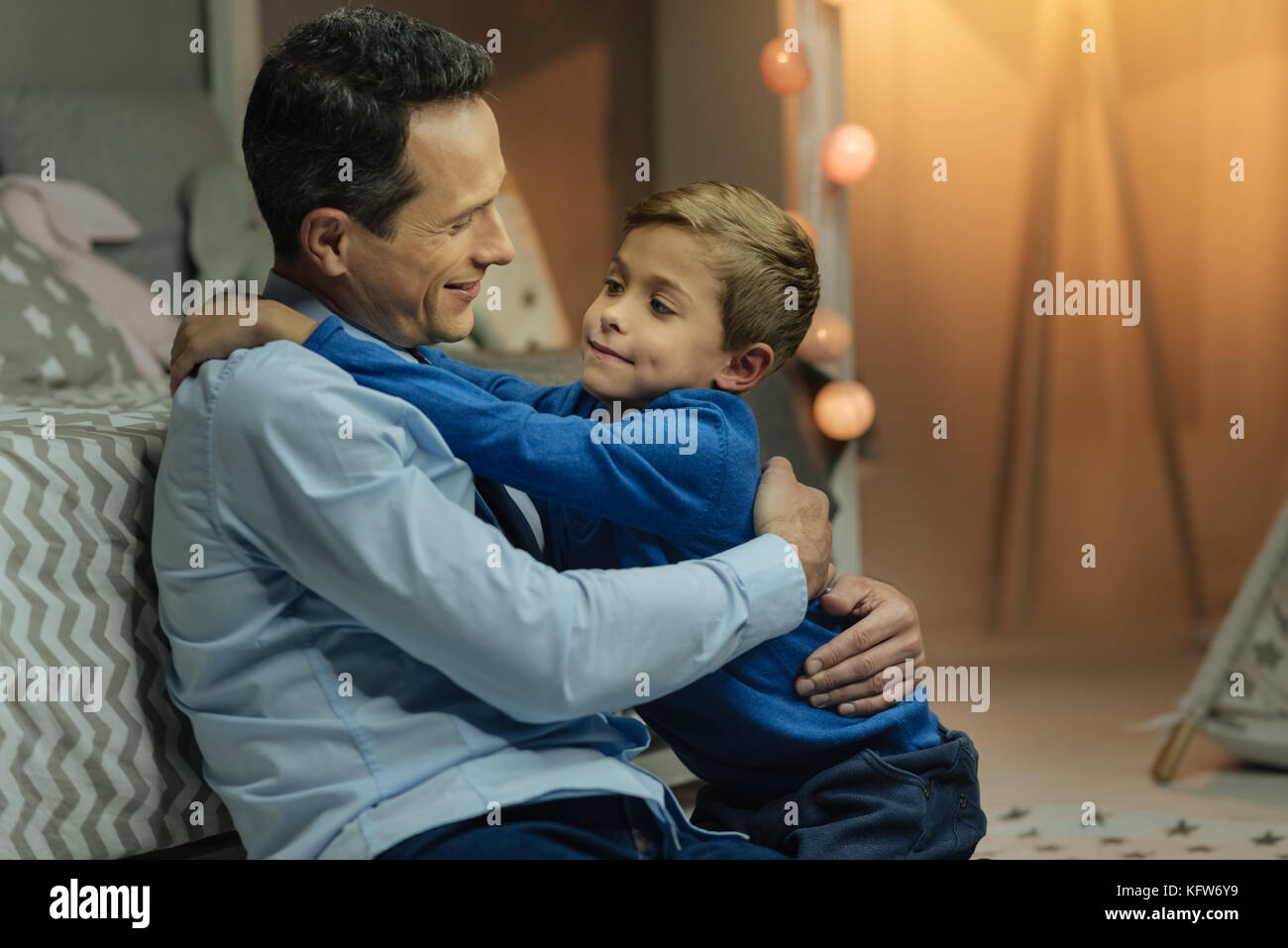 Happy kid embracing his daddy Stock Photo - Alamy