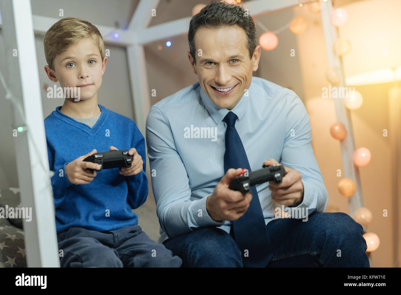 Amazing boy playing games with his dad Stock Photo - Alamy