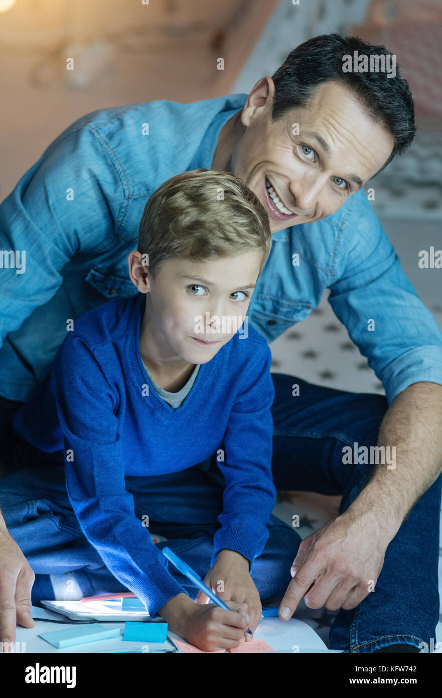 Joyful little boy looking sideways Stock Photo - Alamy