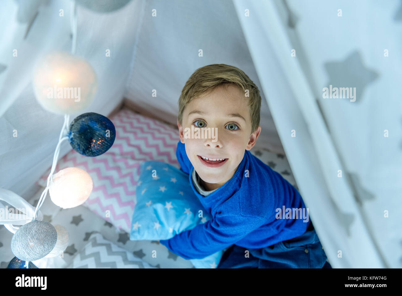 Top view picture of smiling kid that looking forward Stock Photo - Alamy