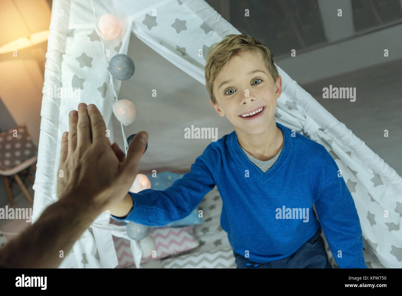 Happy kid touching hands with father Stock Photo - Alamy