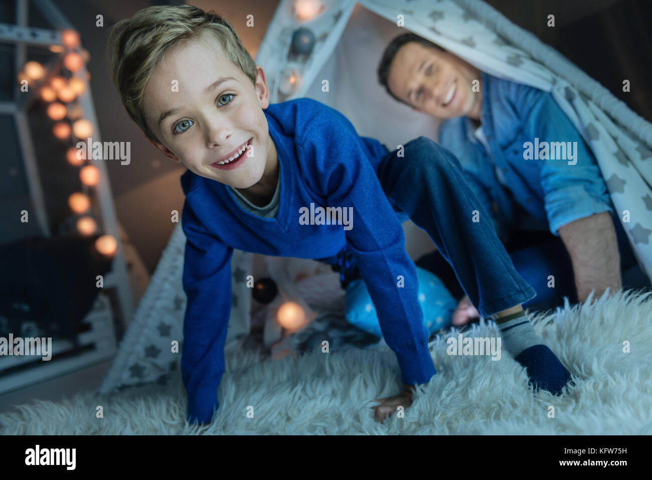 Positive delighted child playing with father Stock Photo - Alamy