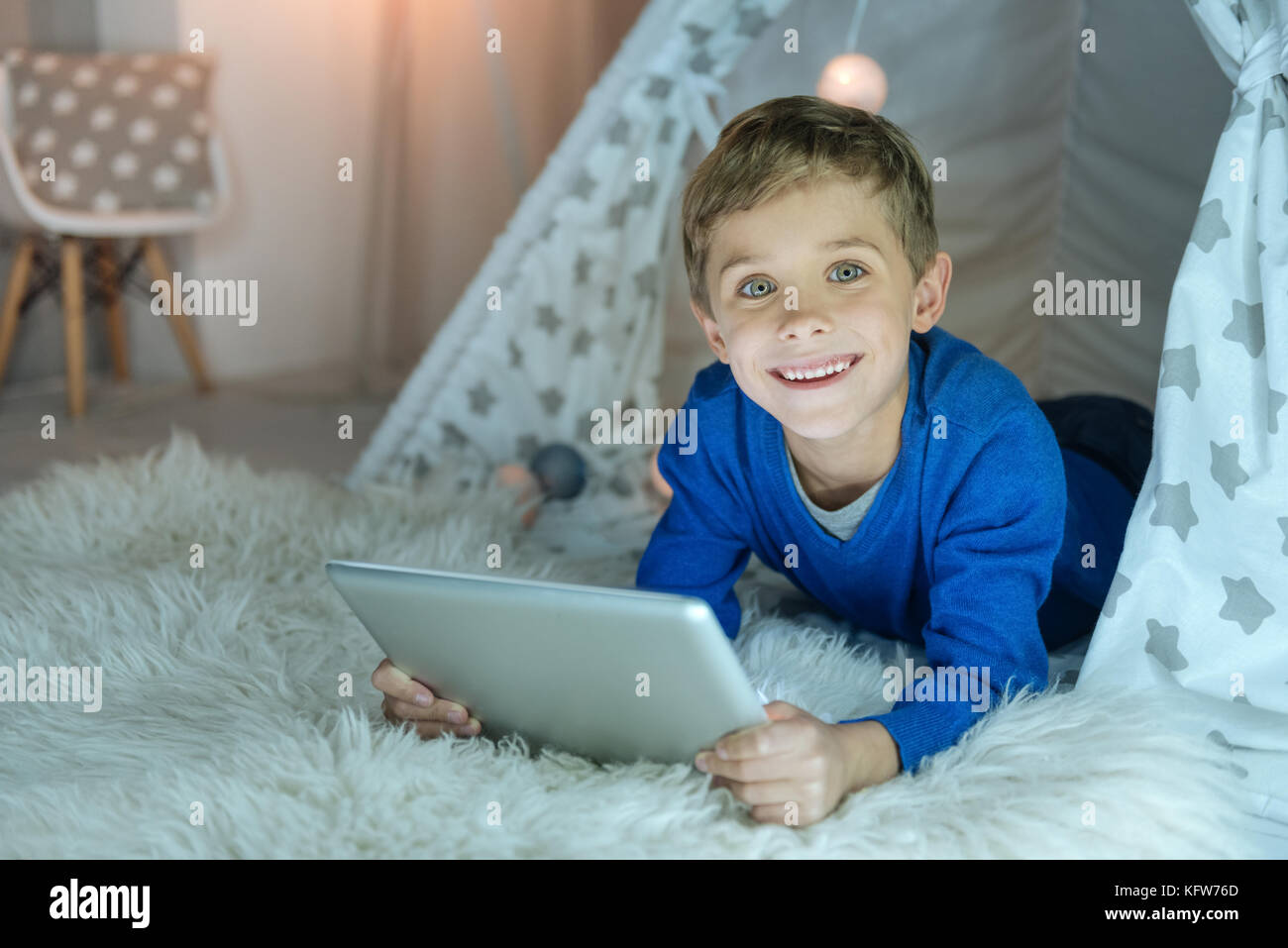 Happy boy looking straight at camera Stock Photo - Alamy