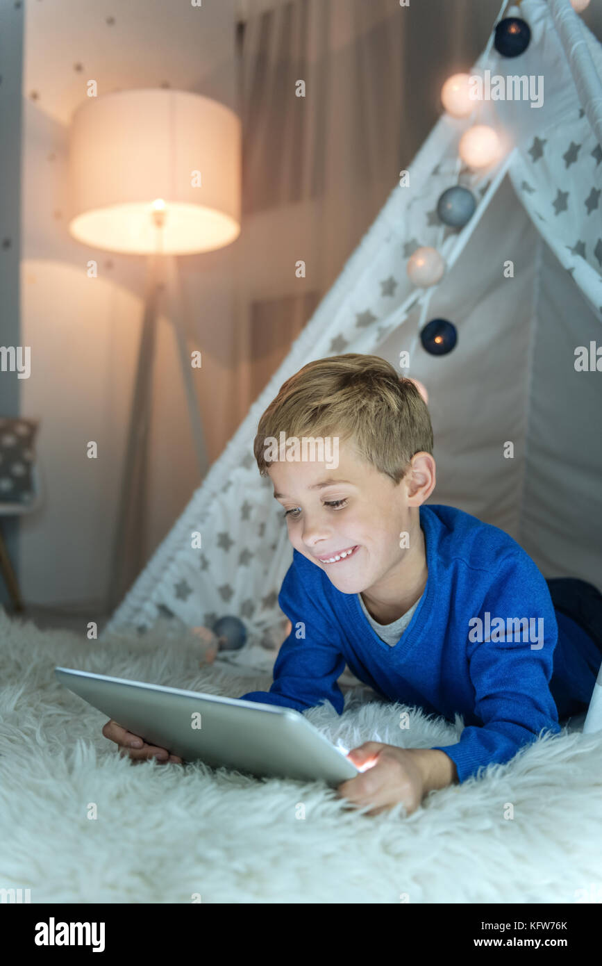 Handsome boy watching funny movies Stock Photo - Alamy