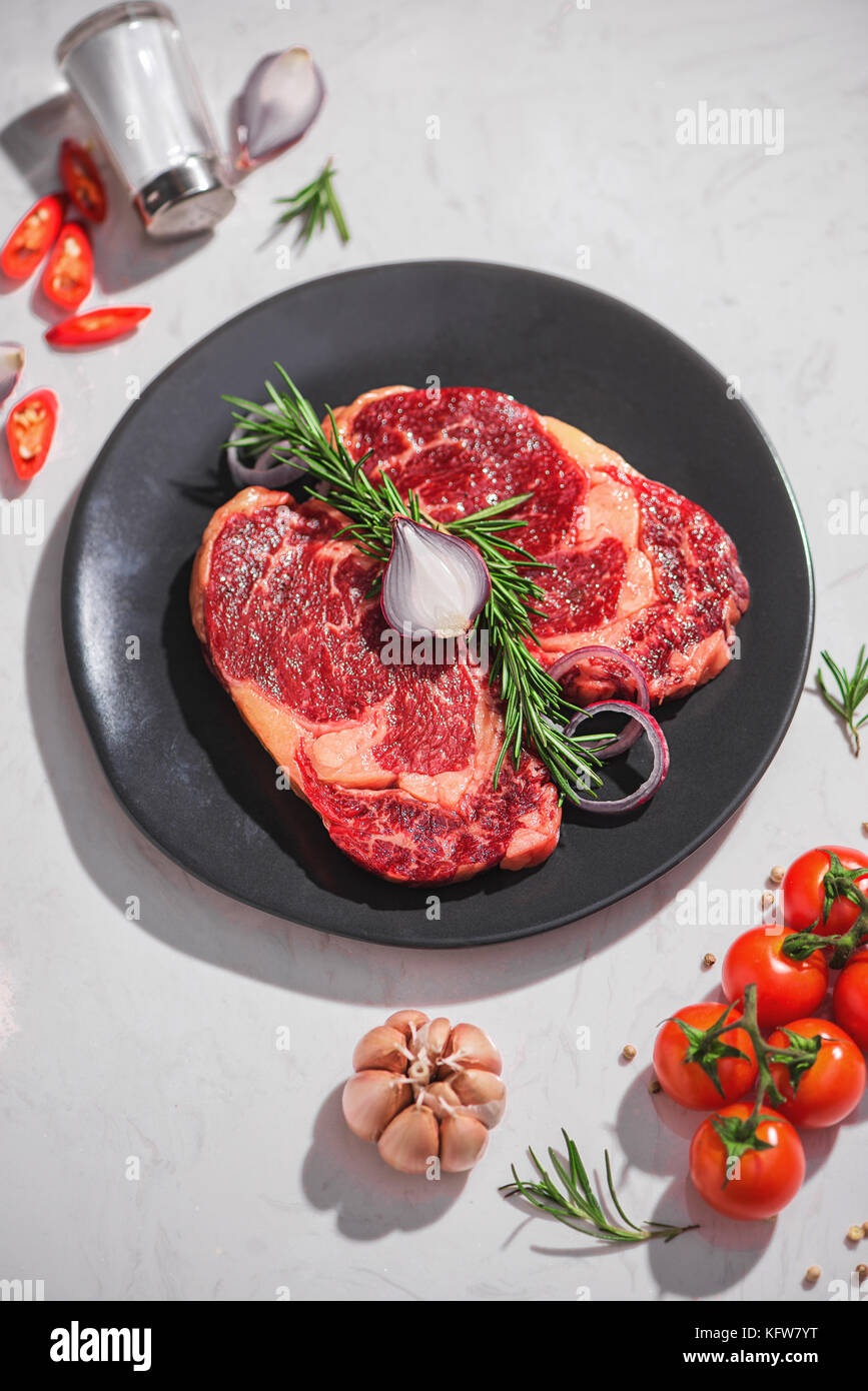 Raw fresh beef on white stone background, top view Stock Photo - Alamy