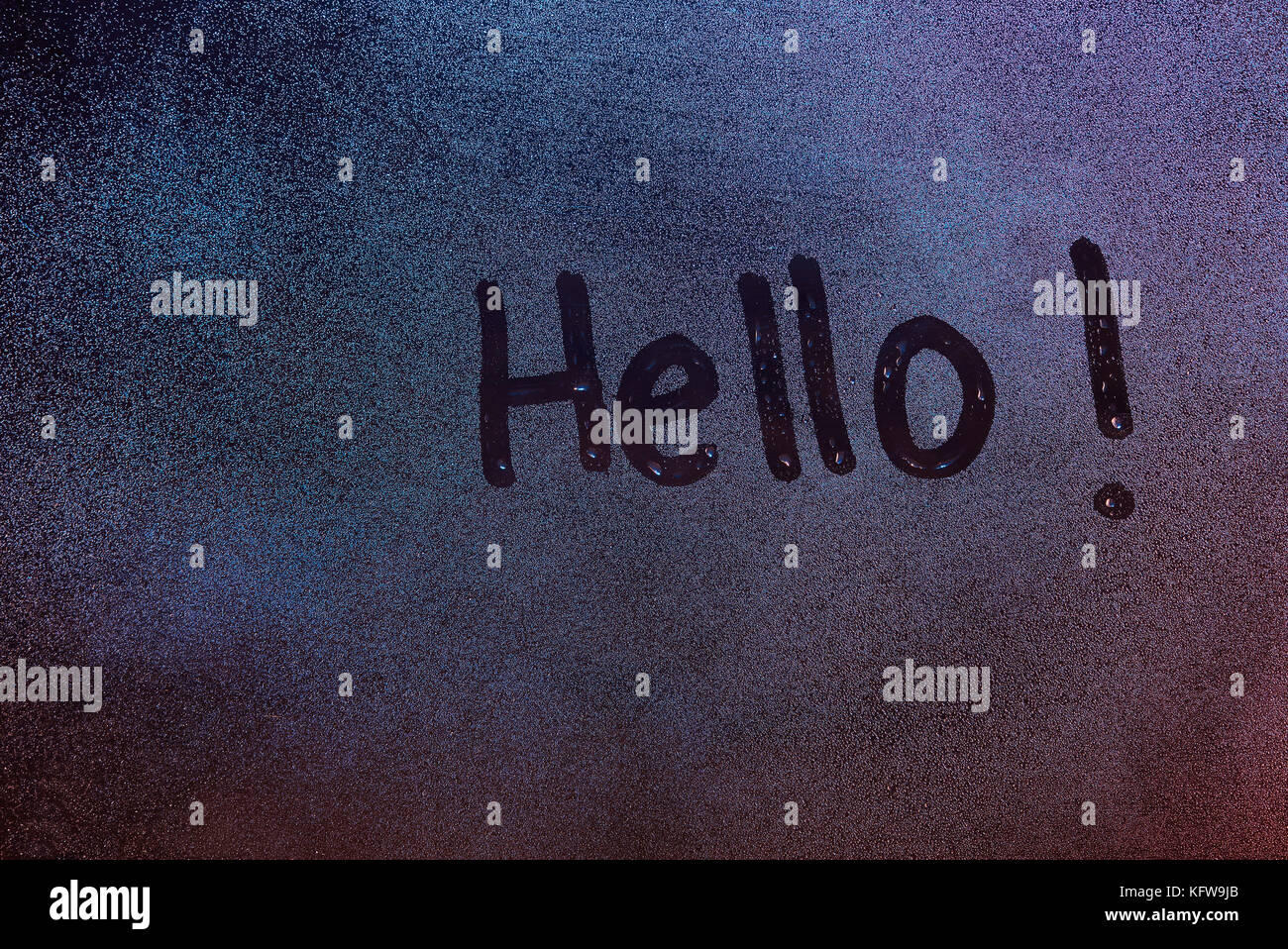 Hello message draw on frozen window background. Hello word on fogged ...