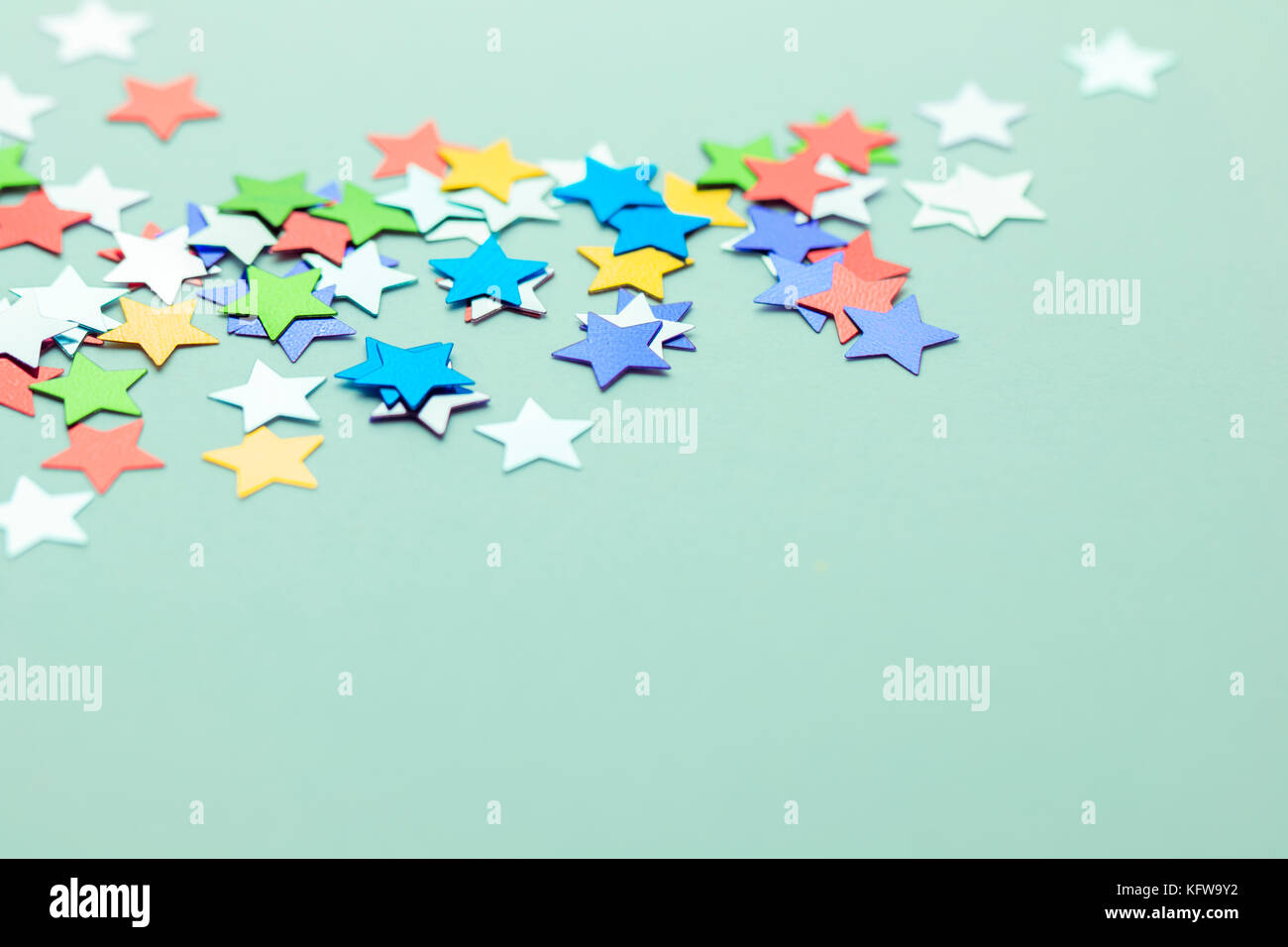 Colorful star confetti on neutral background with space for text Stock ...