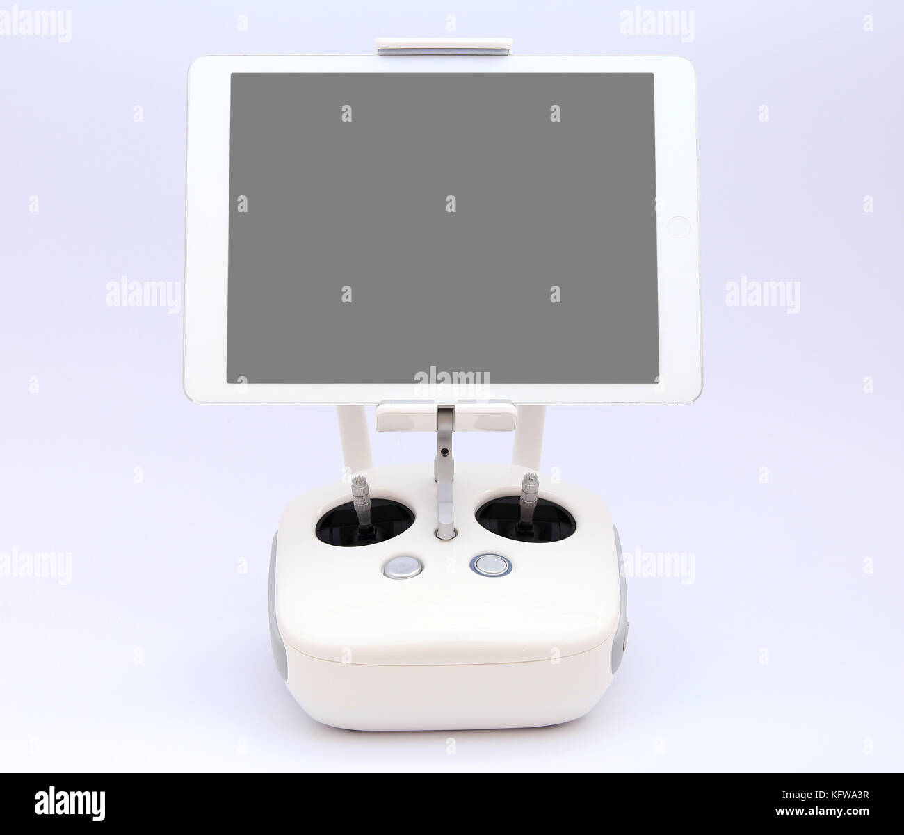 Remote controller of drone with white tablet Stock Photo - Alamy
