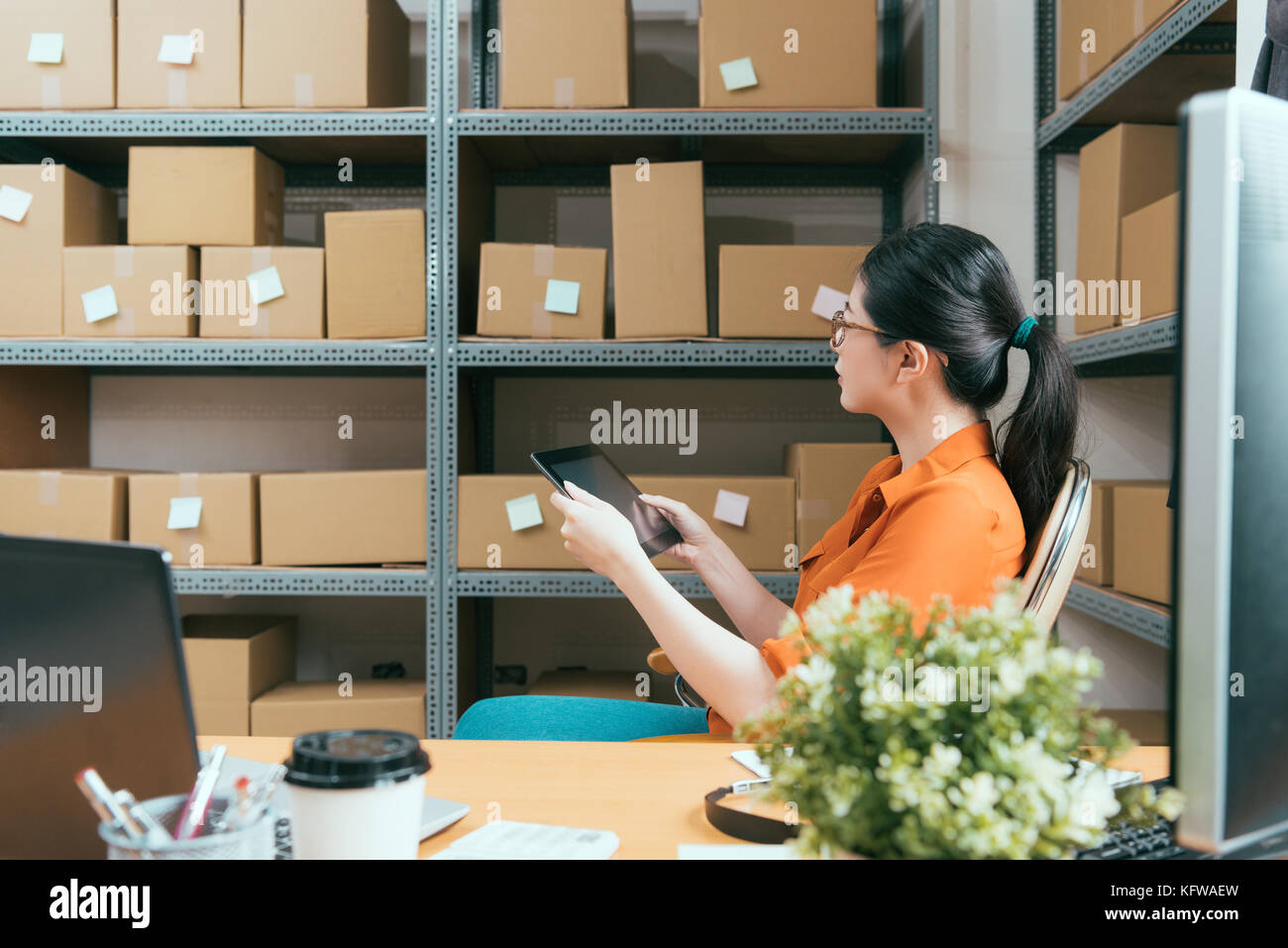 side view photo of pretty young online shopping company worker holding ...