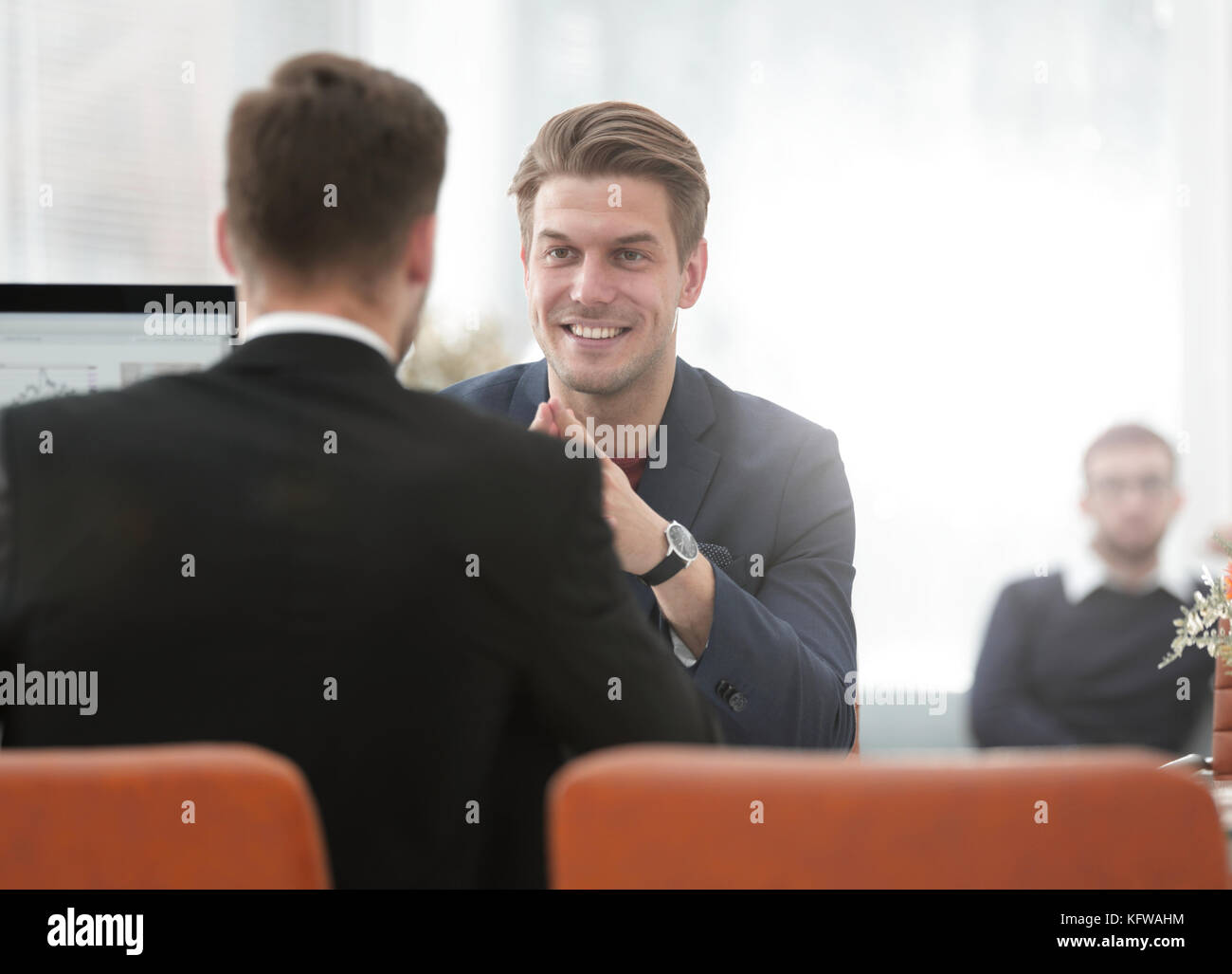 Two men discuss in the workplace. office life Stock Photo - Alamy