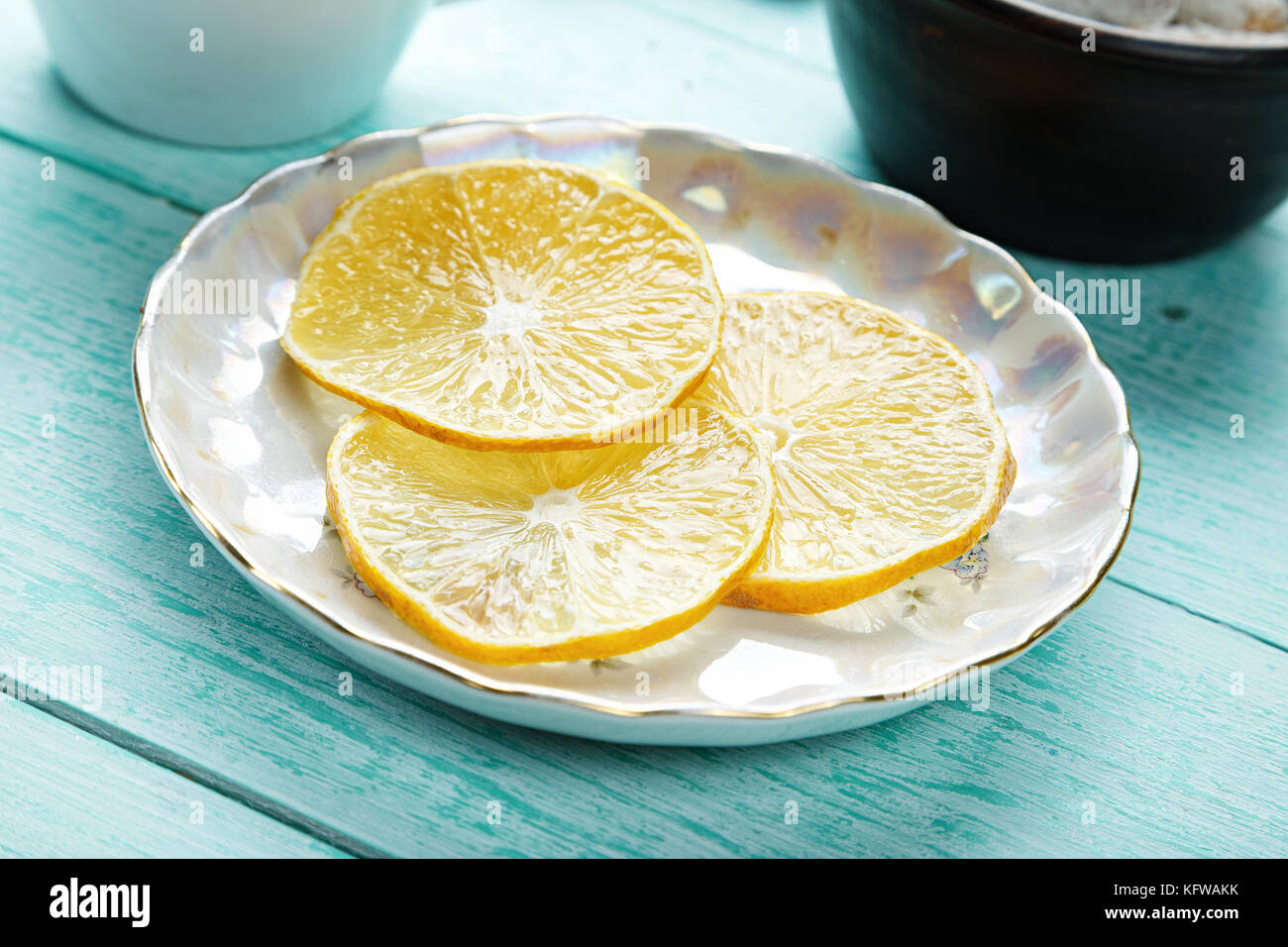 home drinking tea, slices of lemon on a saucer, a healthy fruit Stock ...
