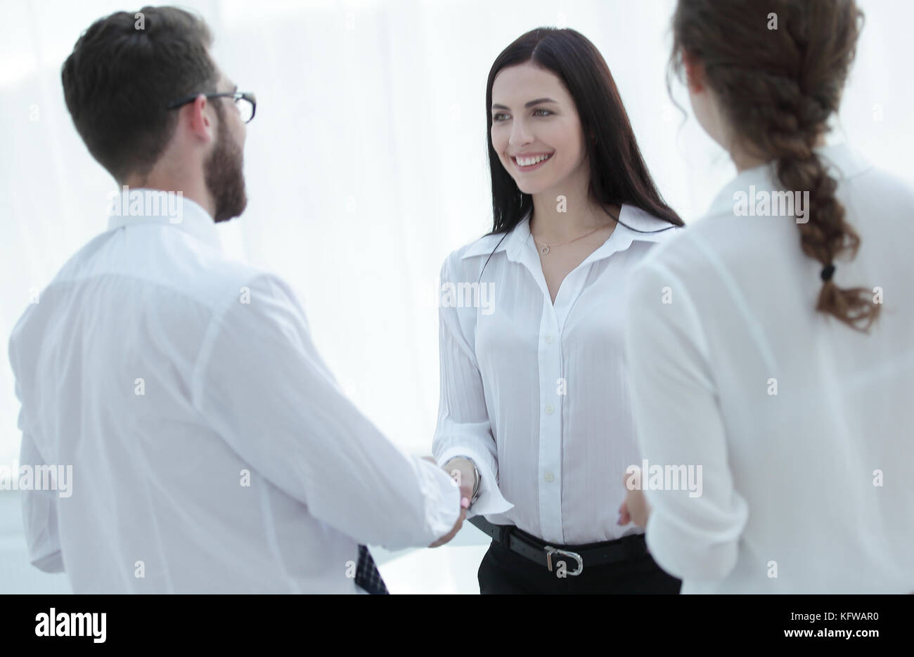 handshake of a young woman boss and a company employee Stock Photo - Alamy