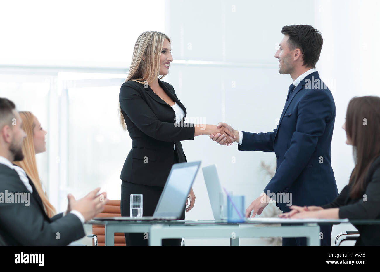 Business a man standing over a desk hi-res stock photography and images ...