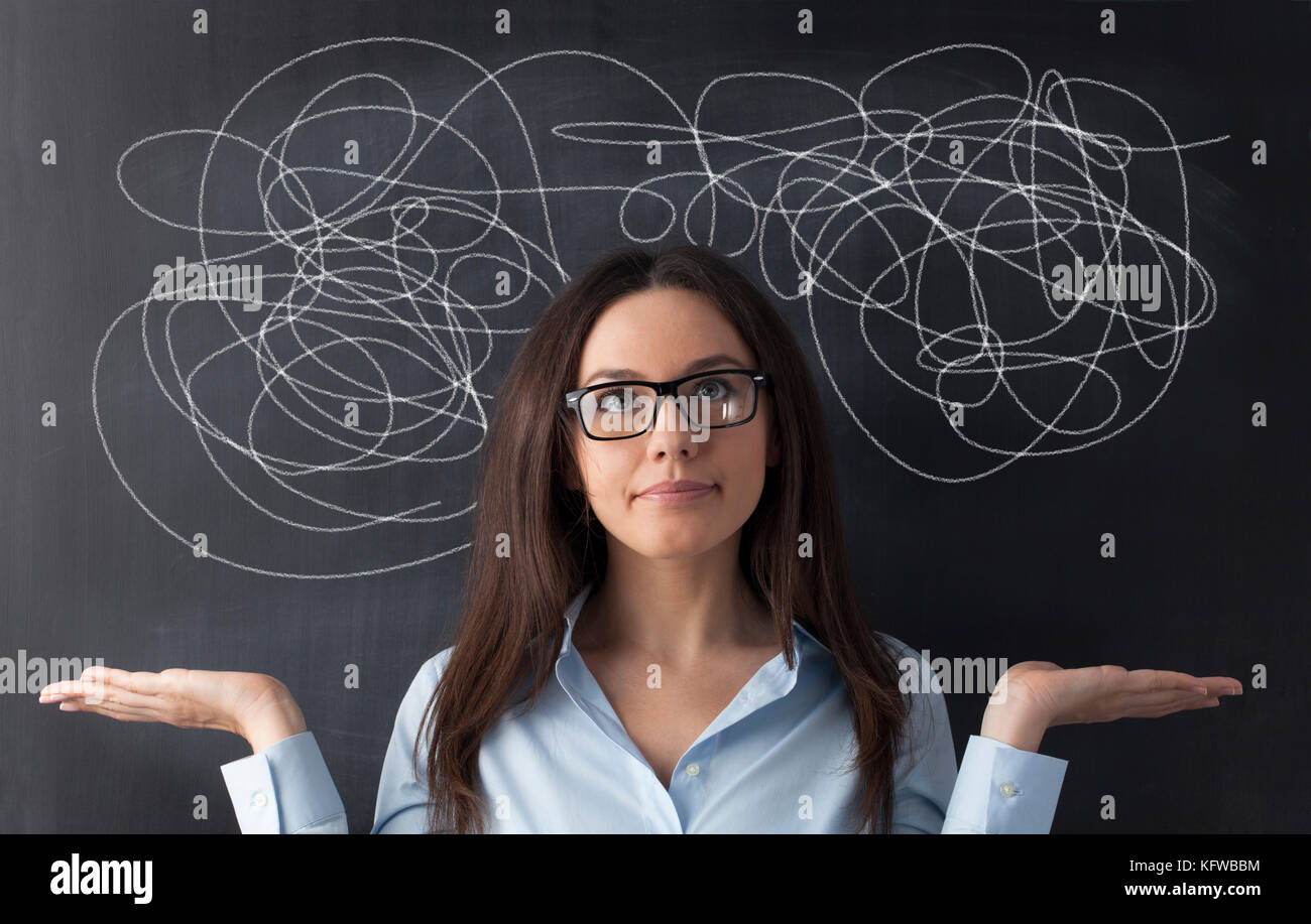 Portrait of confused businesswoman on blackboard Stock Photo - Alamy