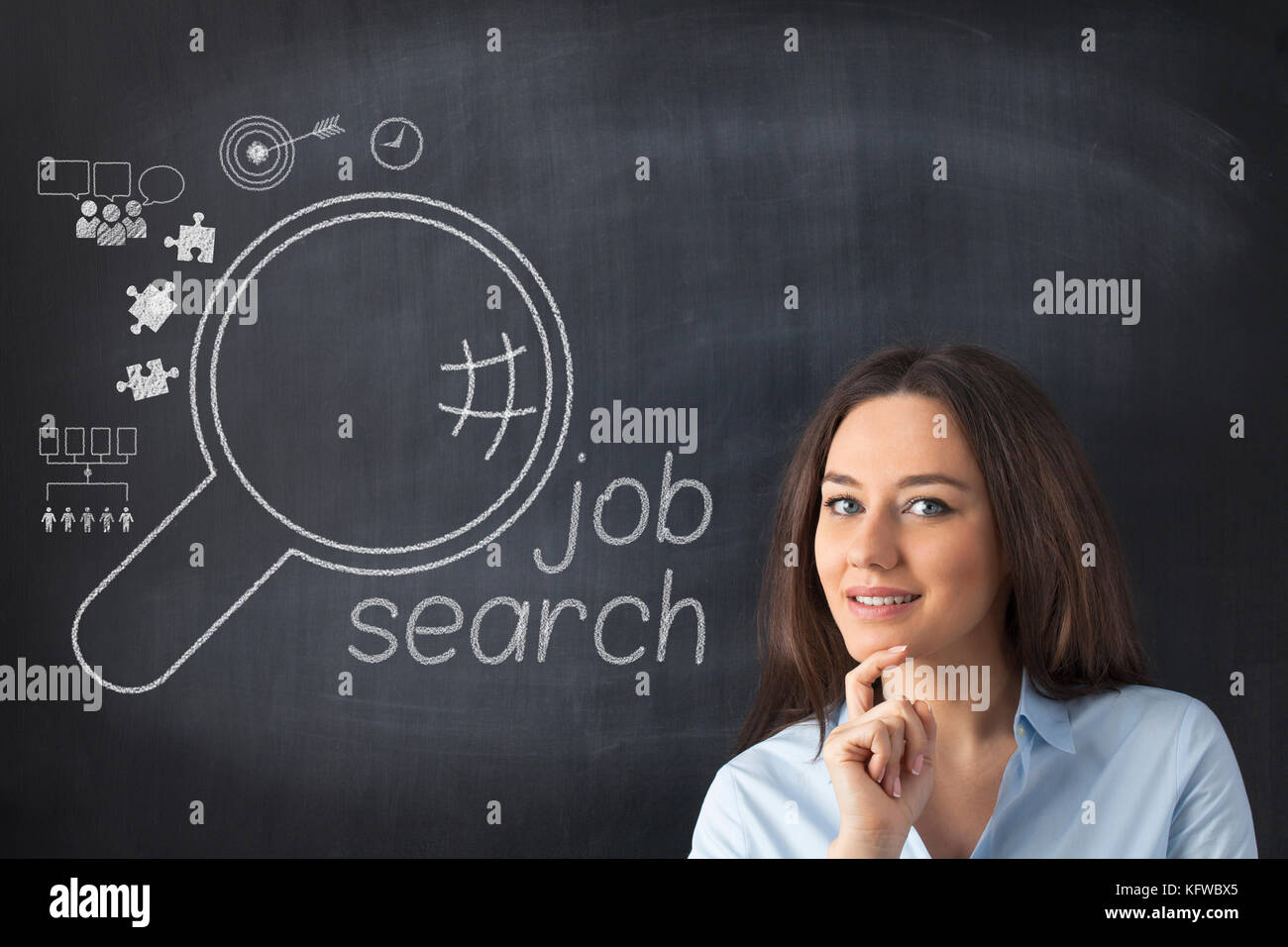 Businesswoman standing front of 'Job Search' text written blackboard ...