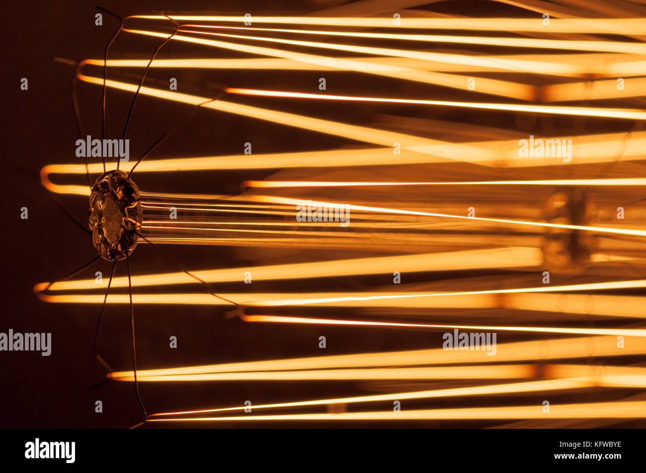 close up of a burning filament in a light bulb Stock Photo - Alamy