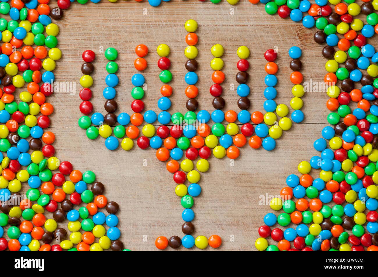 Hanukkah menorah made out of colorful candy Stock Photo - Alamy