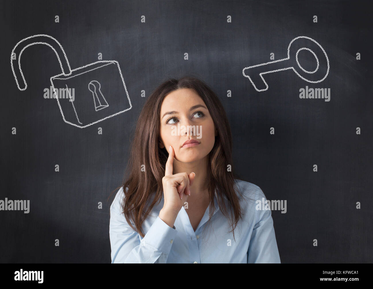 Businesswoman solving the problem Stock Photo - Alamy
