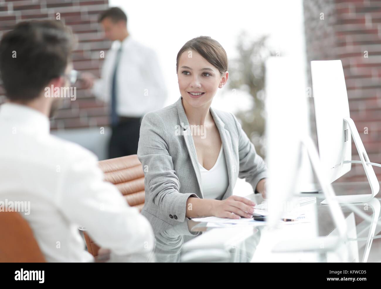 business woman talking with a client Stock Photo - Alamy