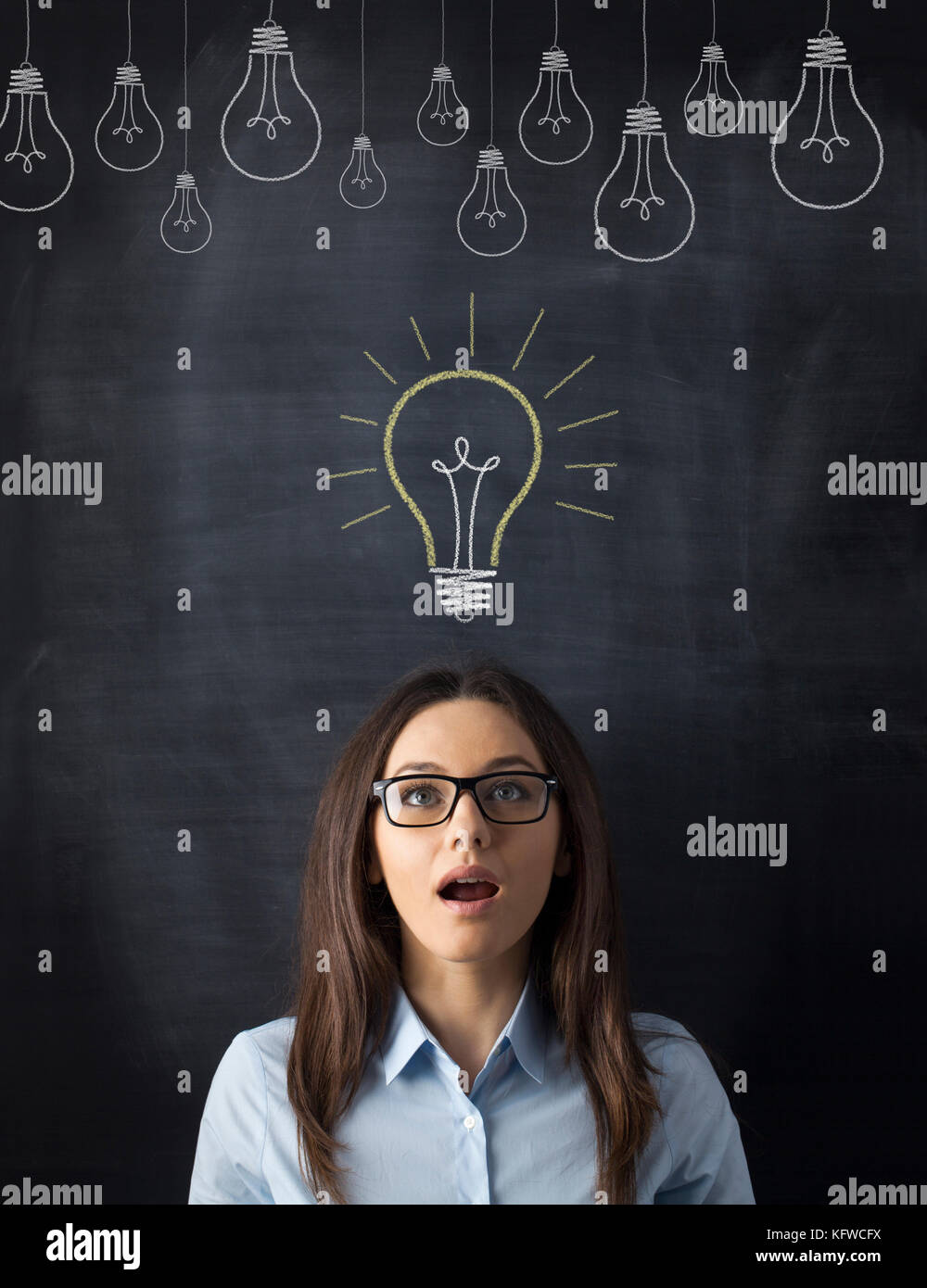 Thinking woman in front of light bulb drawing blackboard Stock Photo ...
