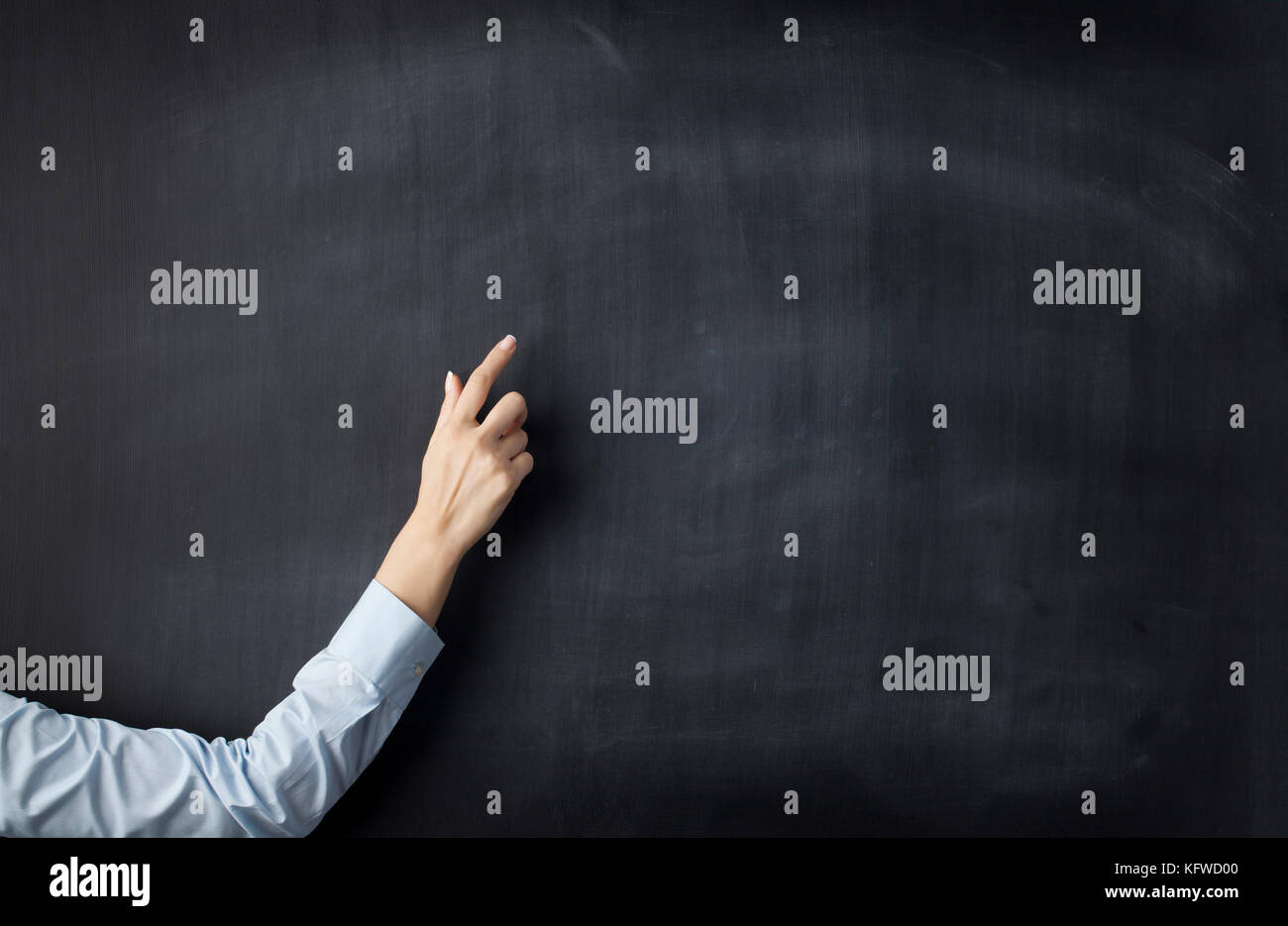 Blank blackboard with businesswoman hand pointing Stock Photo - Alamy