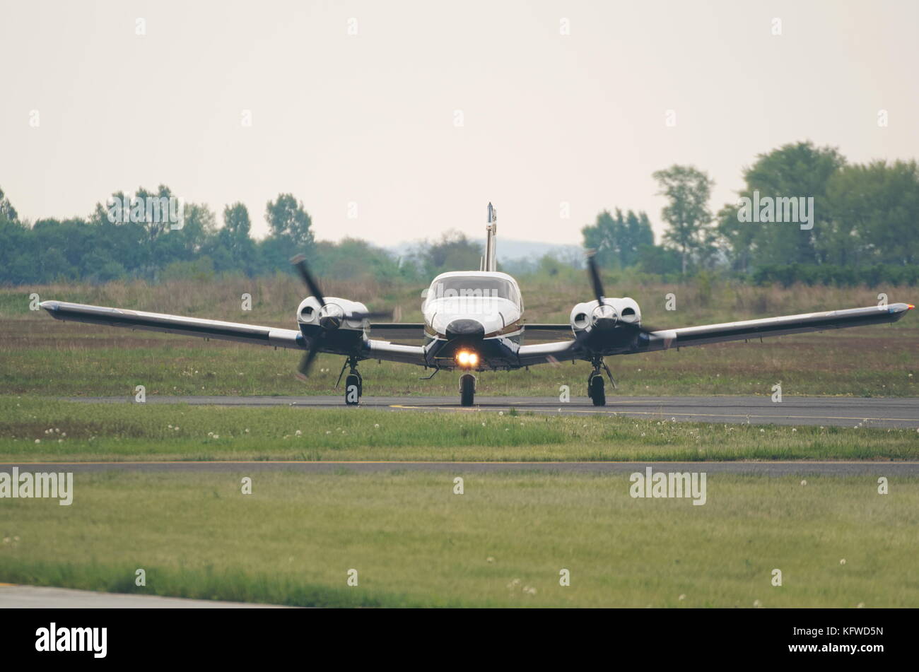 Small Aircraft Landing with Two Motor Front View Stock Photo - Alamy