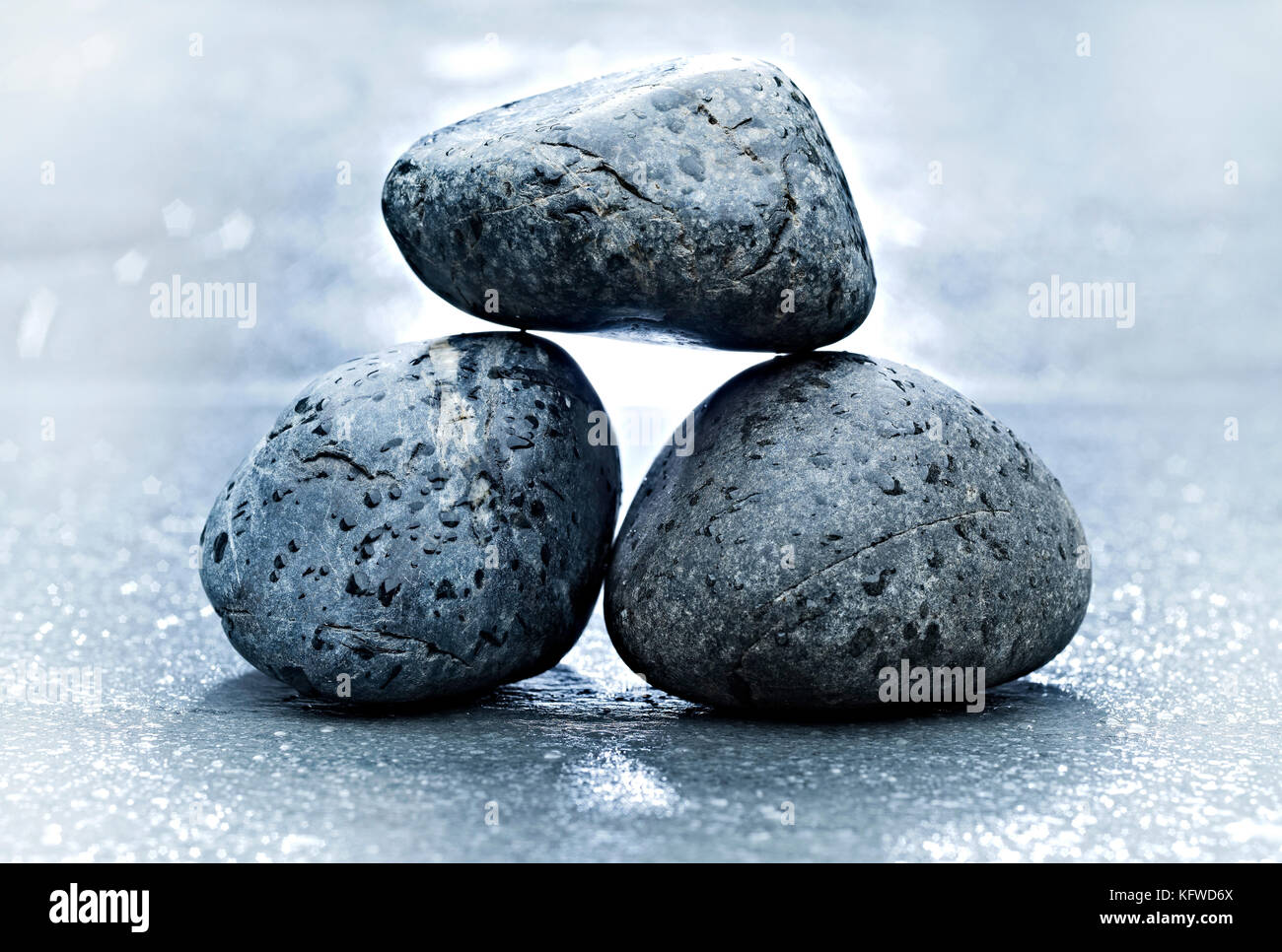 tree grey pebble rocks on wet background Stock Photo - Alamy