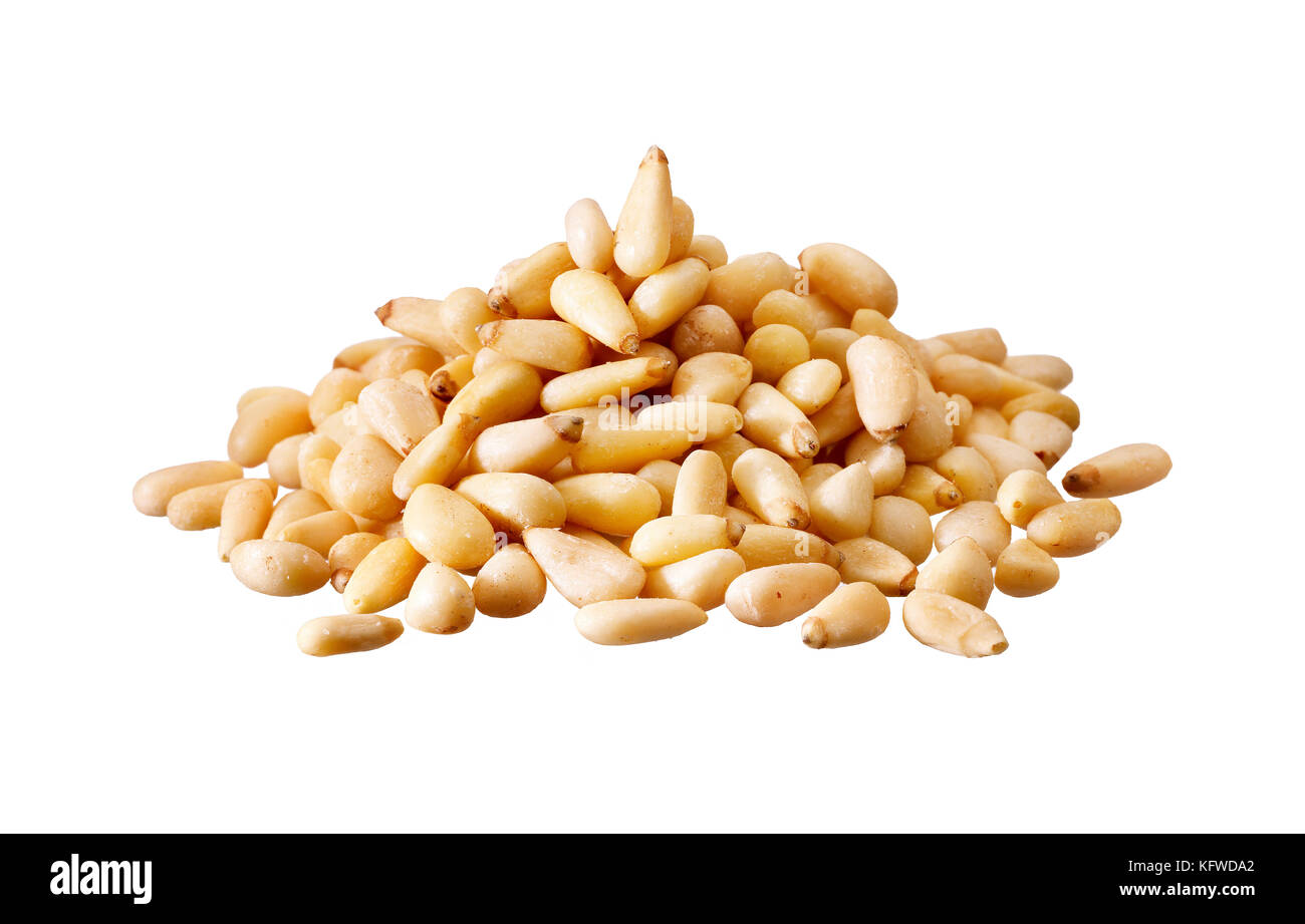 heap of pine nuts isolated on white Stock Photo - Alamy