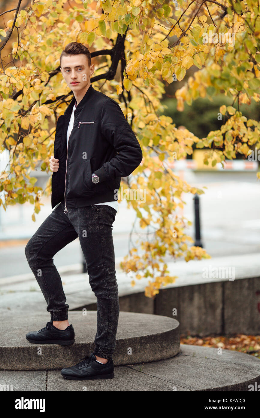 Young boy look at his watch and smile Stock Photo - Alamy