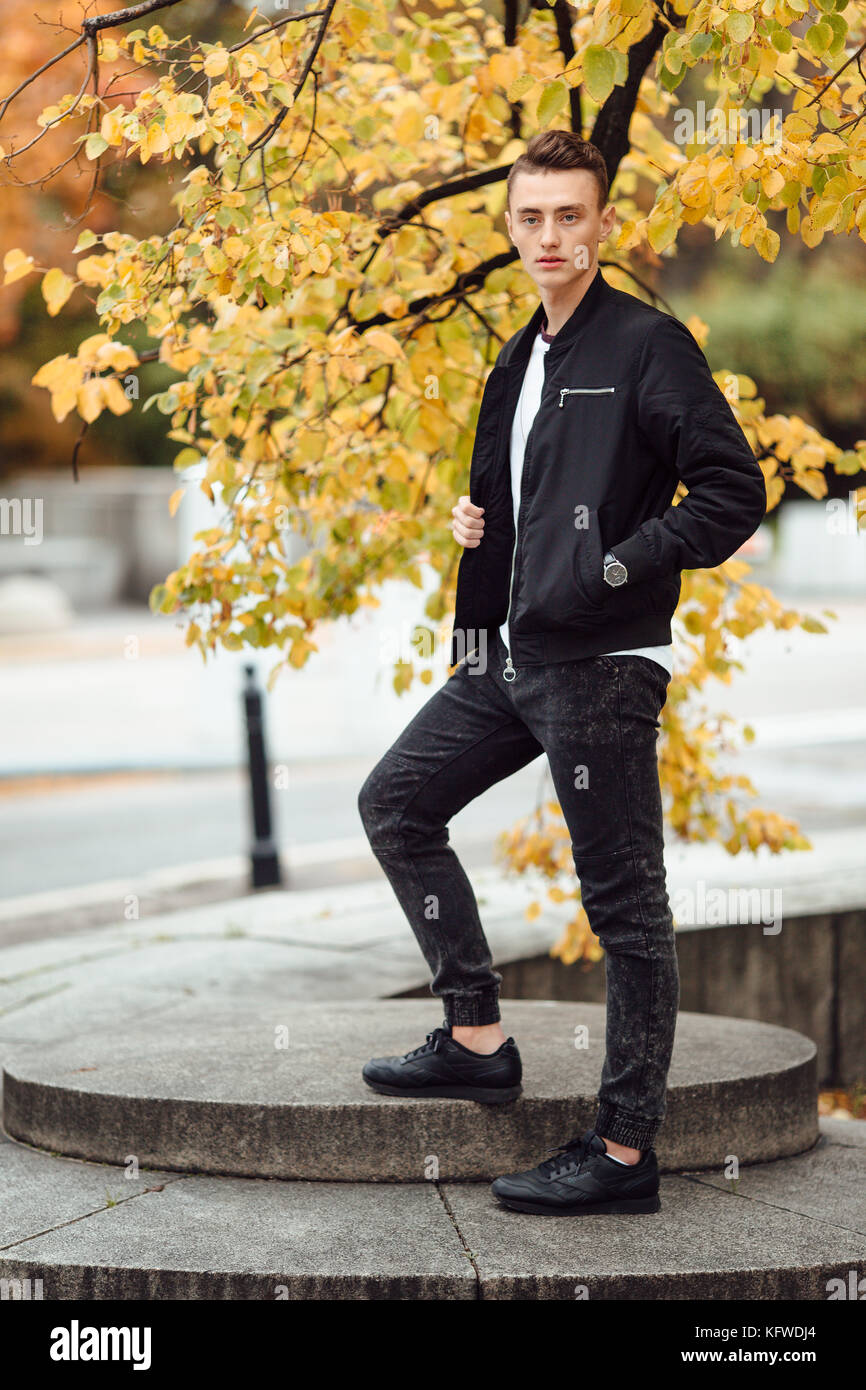 Young boy look at his watch and smile Stock Photo - Alamy
