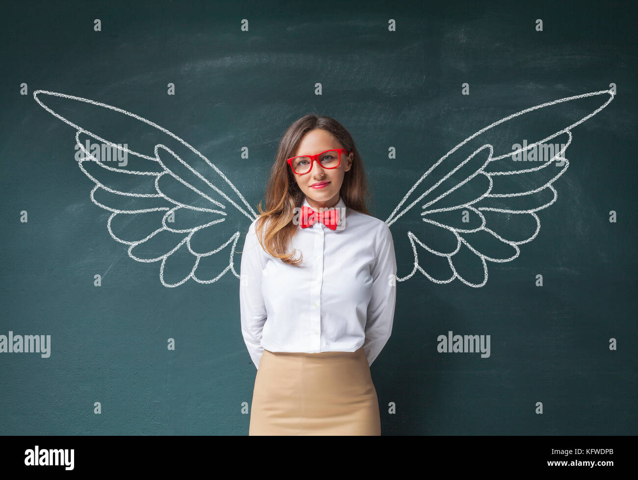 Young smiling woman teacher or student angel with chalk wings on ...