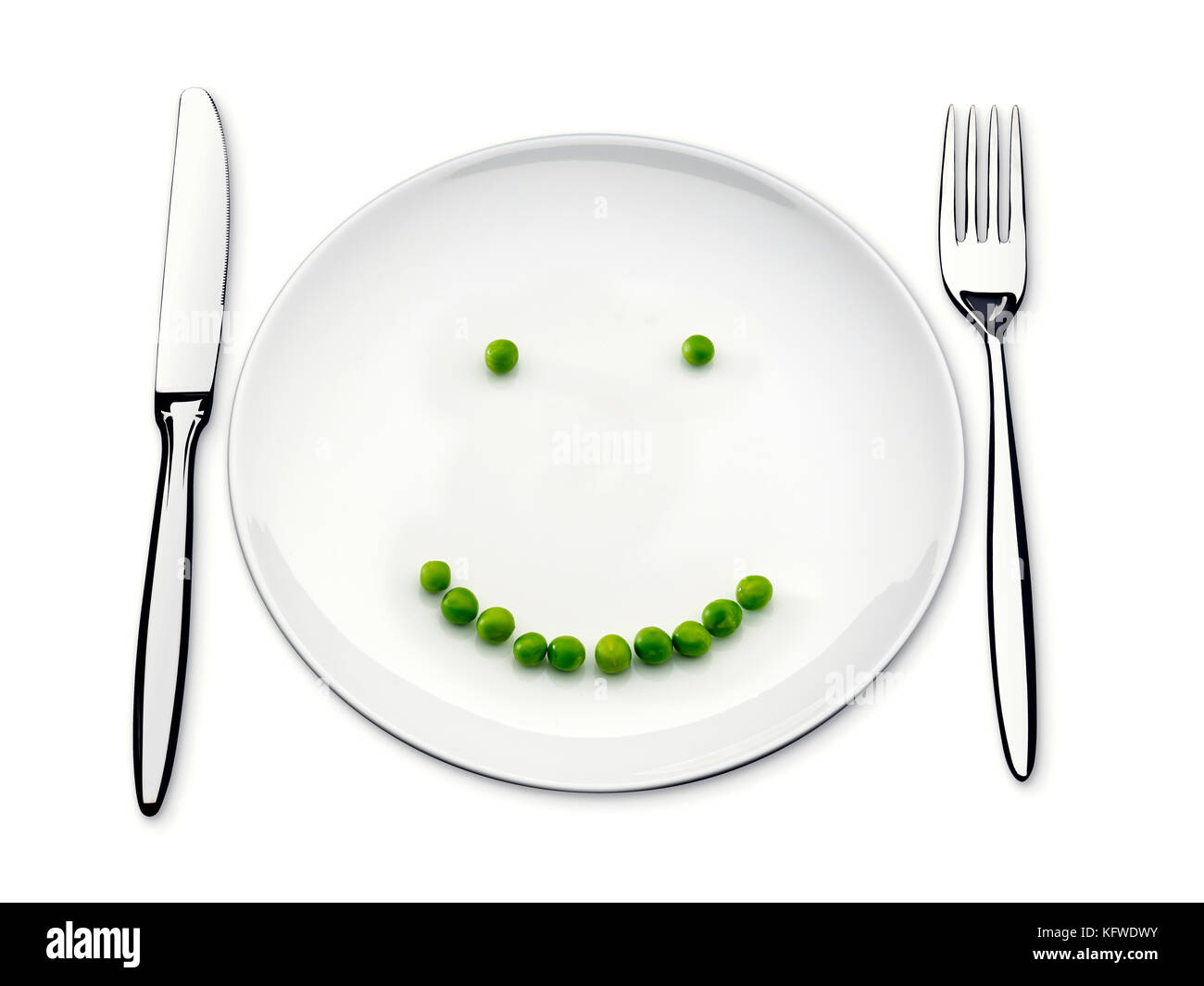 dinner plate with pea in the shape of a smile Stock Photo - Alamy